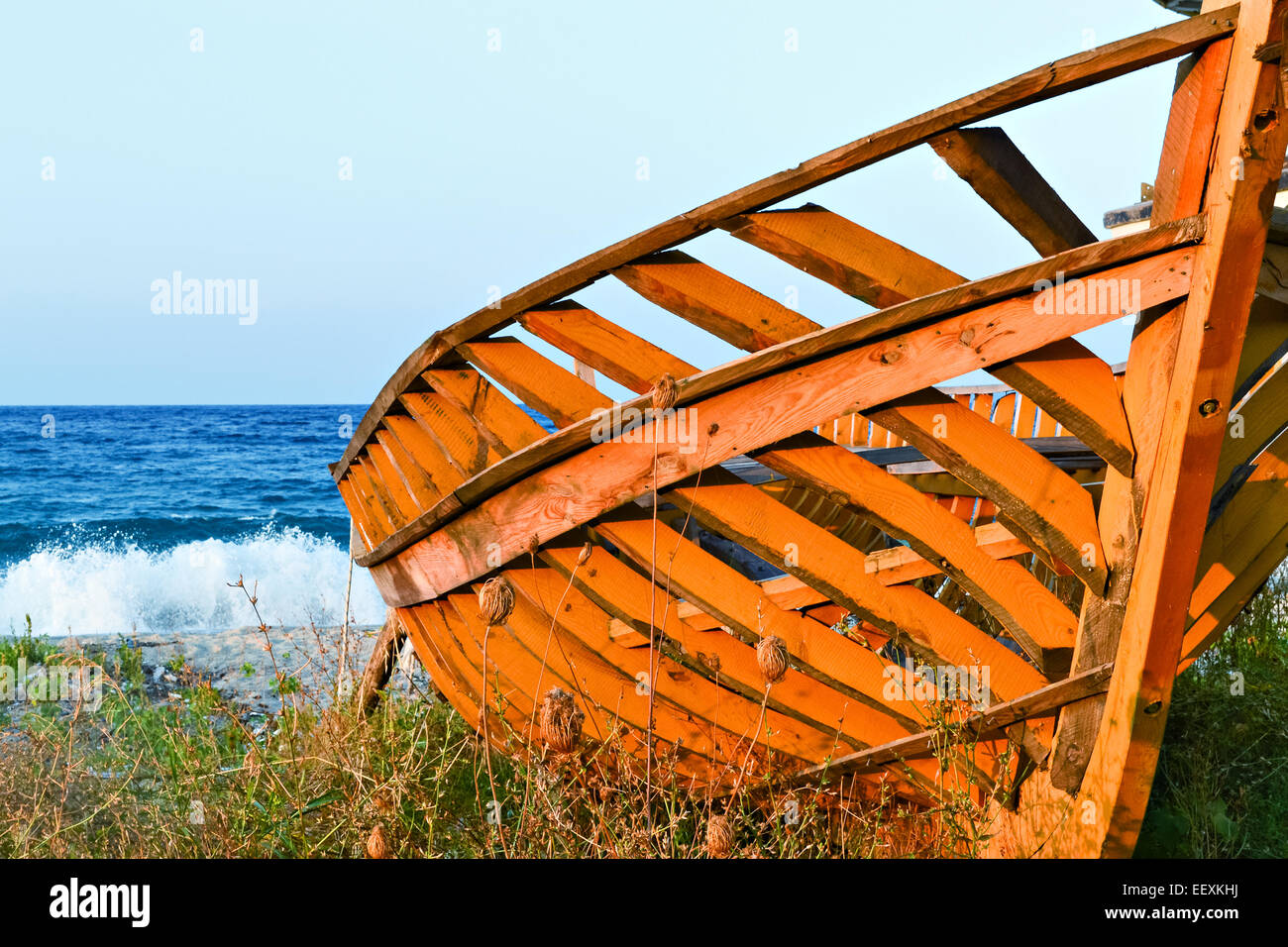 Wooden structure of a small boat on the coast at sunset Stock Photo - Alamy