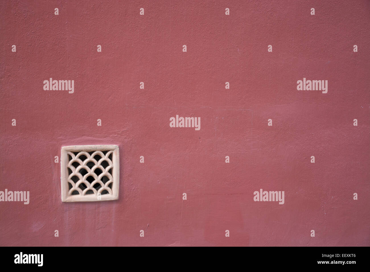Red stucco wall with detail Stock Photo - Alamy