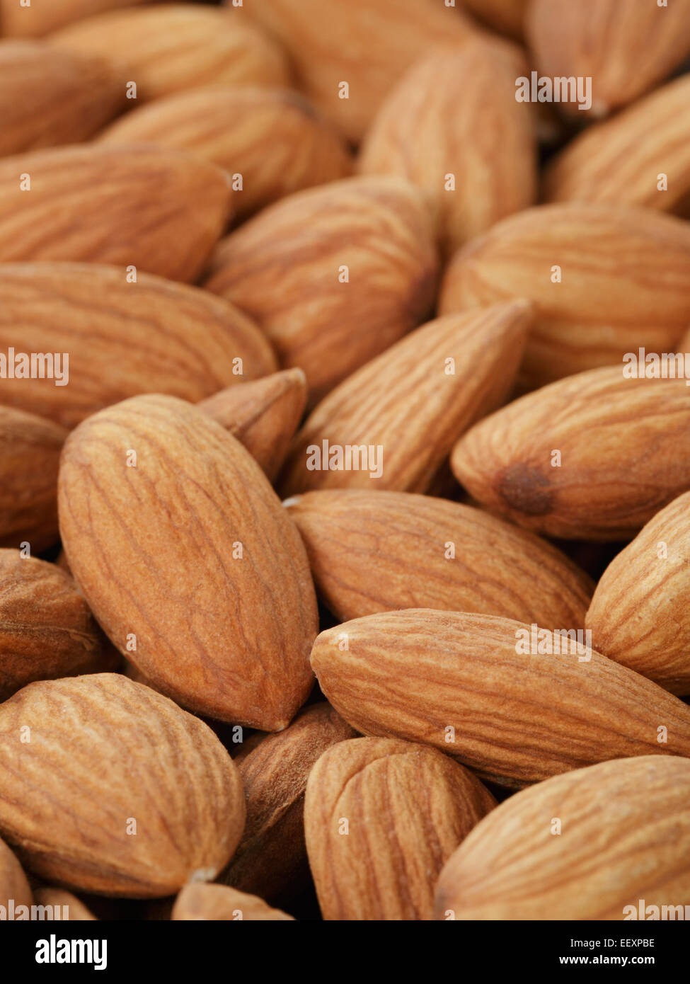 fresh almond peeled nuts background, close up photo Stock Photo - Alamy