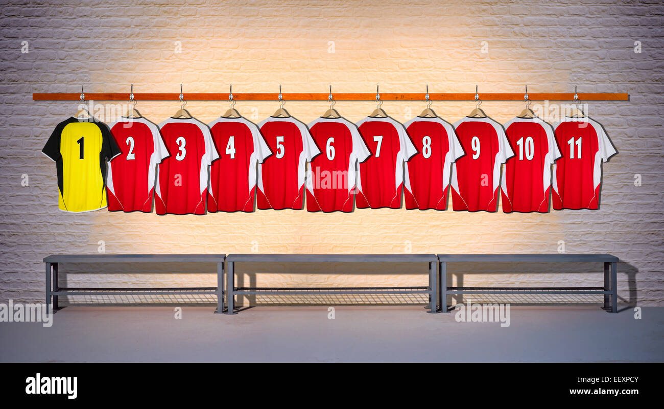 Row of red football shirts hanging in locker room Stock Photo - Alamy