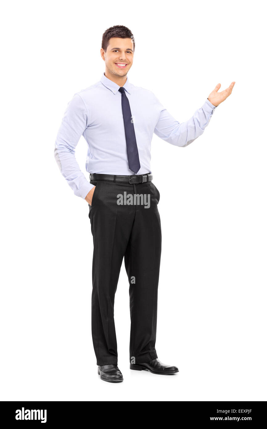Full length portrait of a young handsome guy gesturing with his hand ...