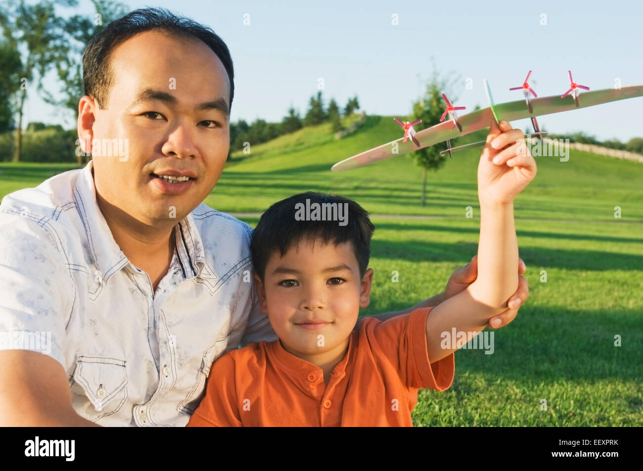 Father and son at the park with a toy airplane Stock Photo - Alamy