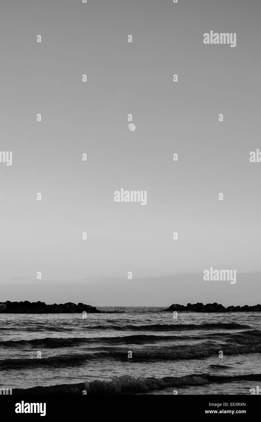 Moonrise over the ocean Black and White Stock Photos & Images - Alamy