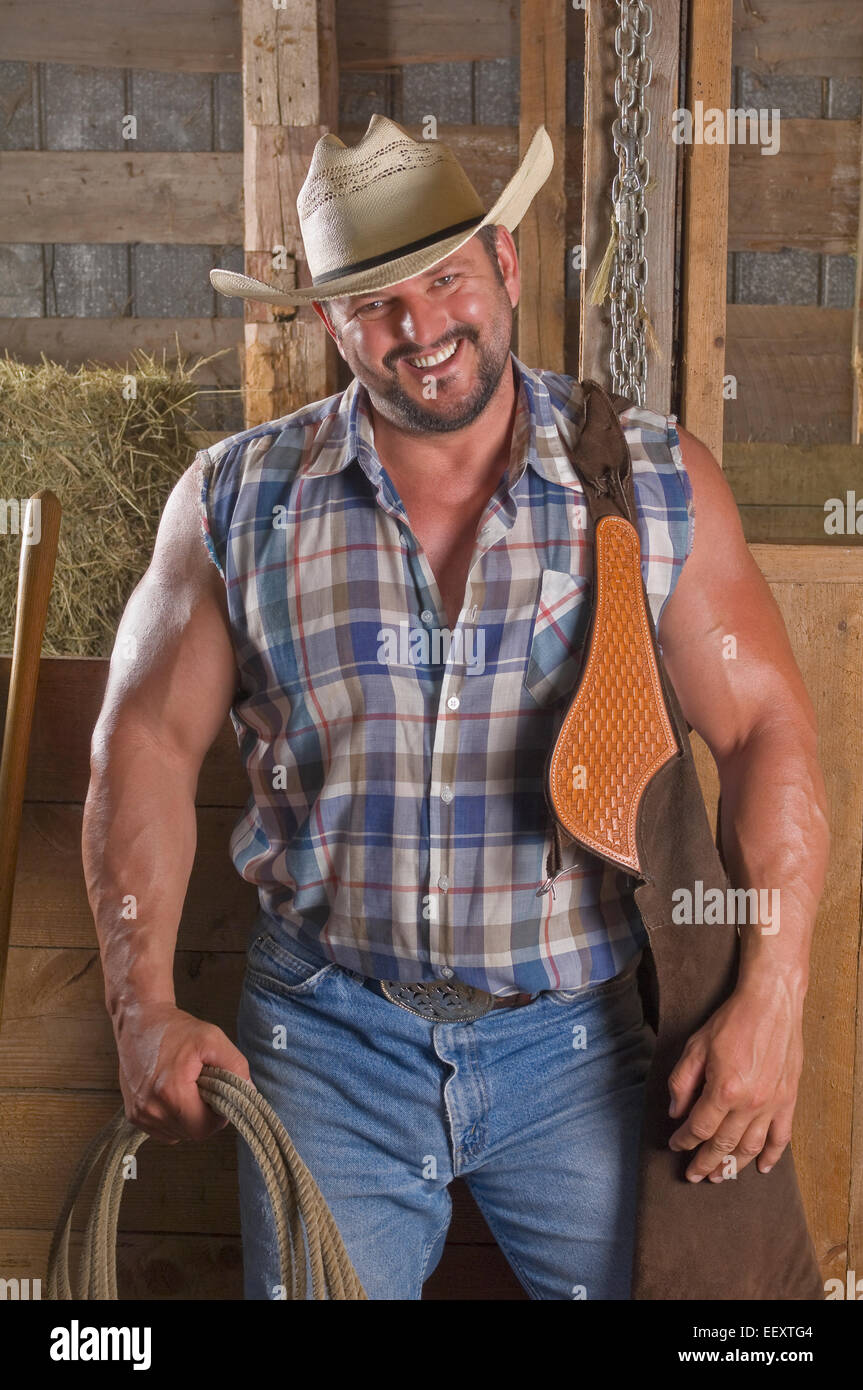 Man in a stable with a rope Stock Photo - Alamy