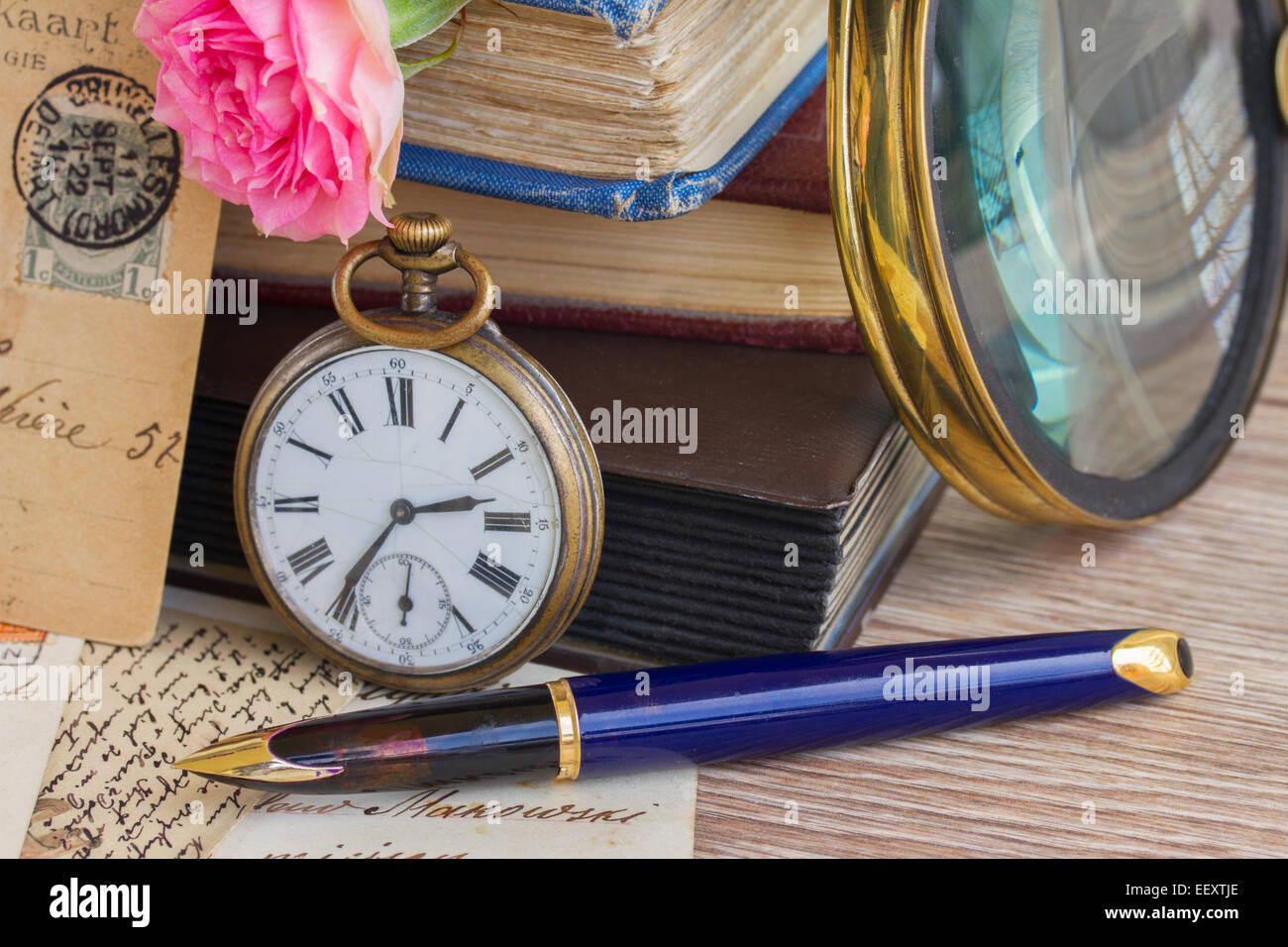 antique clock on old books and letters background Stock Photo - Alamy