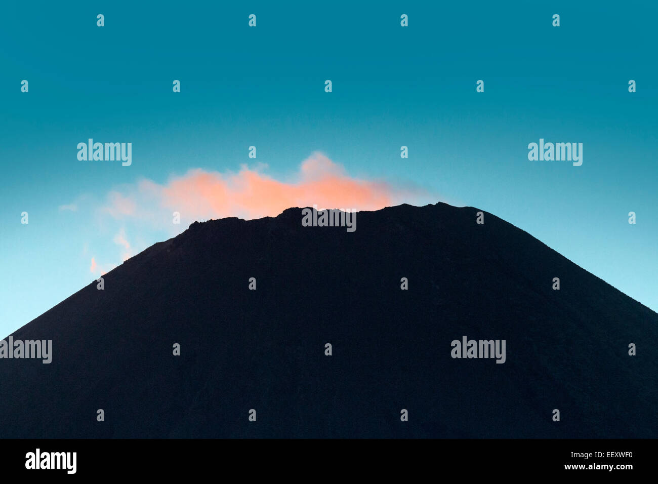 Smoking peak of active 1610m Volcan Concepcion at sunset on Omotepe ...