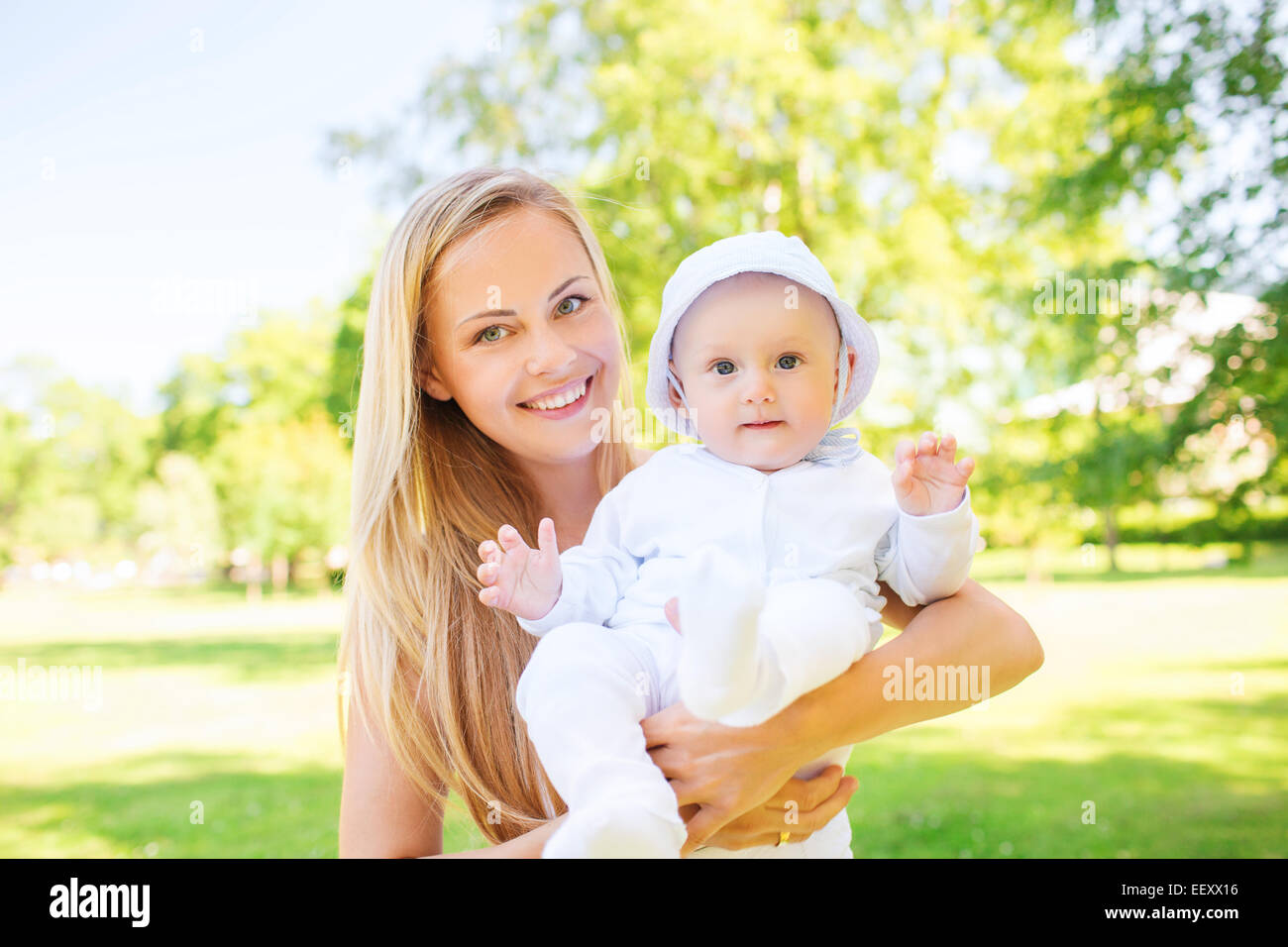 happy mother with little baby in park Stock Photo - Alamy