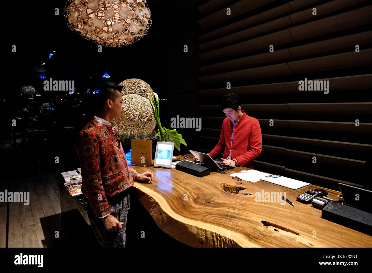 Front desk staff in the luxurious Sofitel So hotel in the city of ...