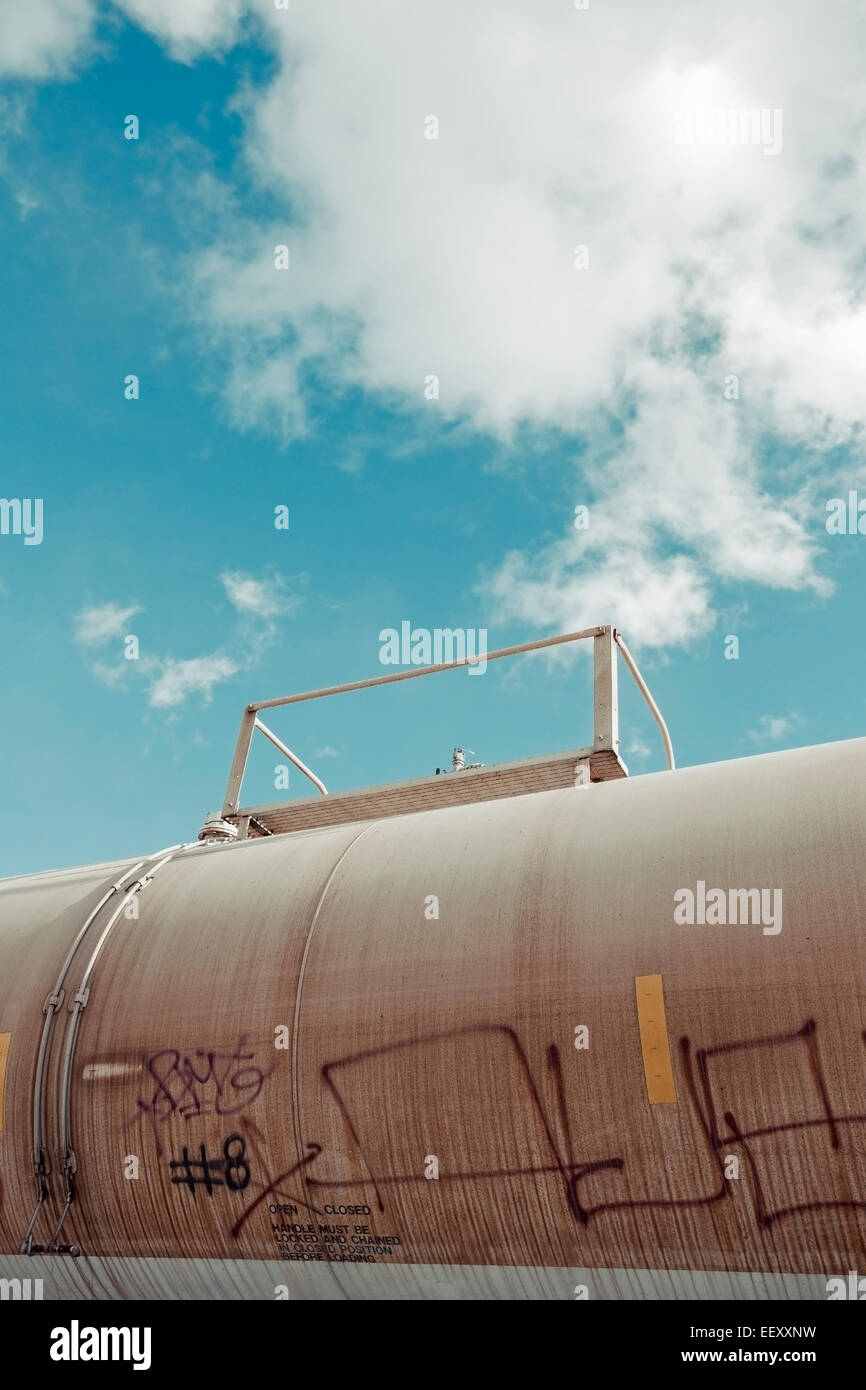 A yellow tanker railroad car under blue skies Stock Photo - Alamy