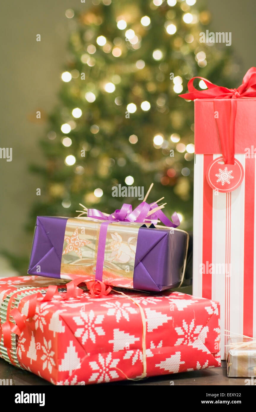 Presents by a Christmas tree Stock Photo - Alamy
