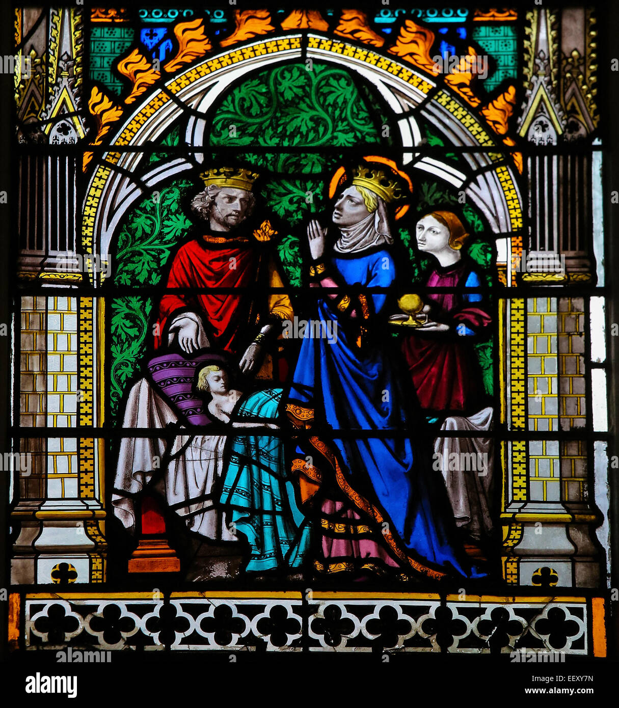 Stained glass window depicting a King and Queen praying for their ill ...