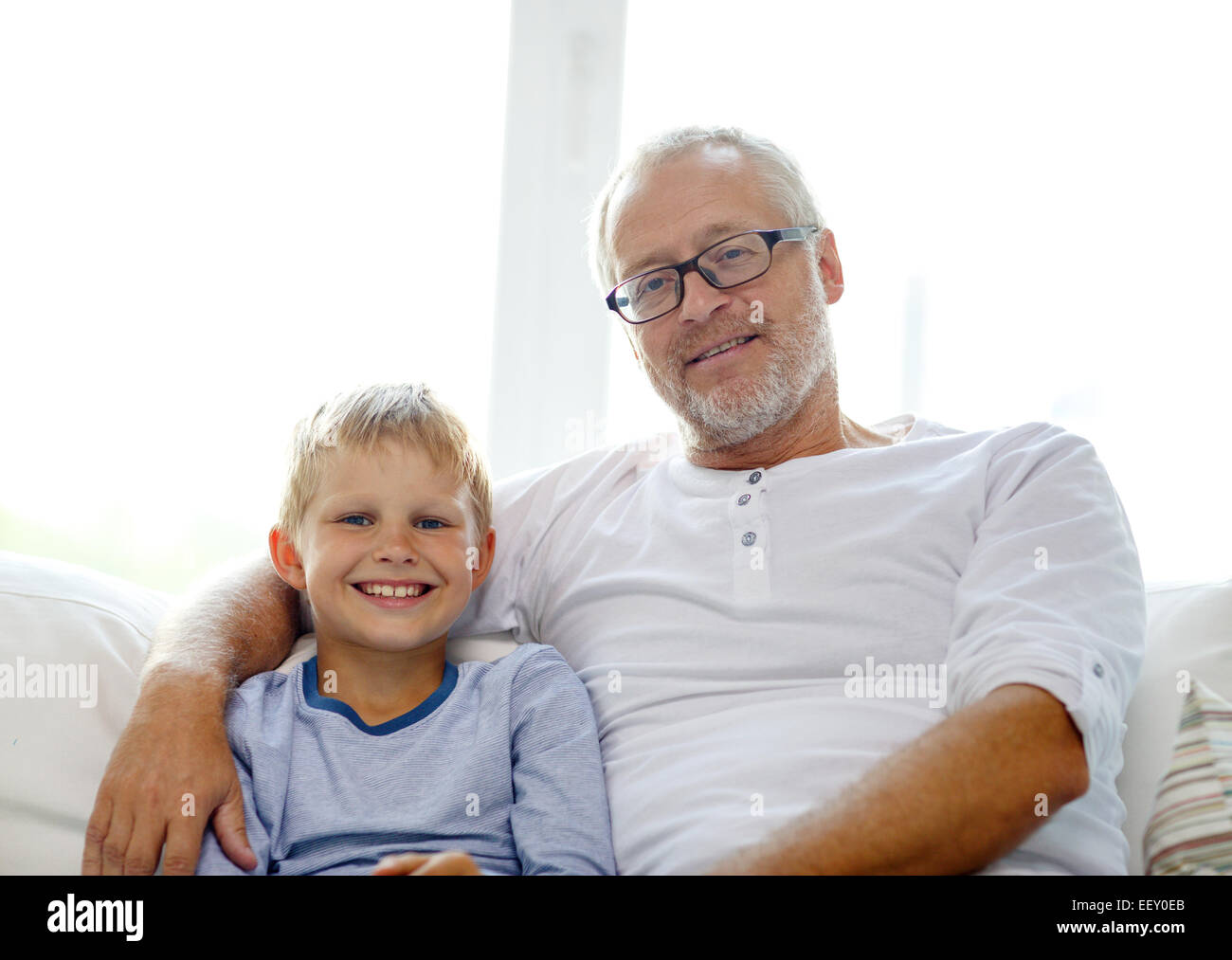 smiling grandfather and grandson at home Stock Photo - Alamy