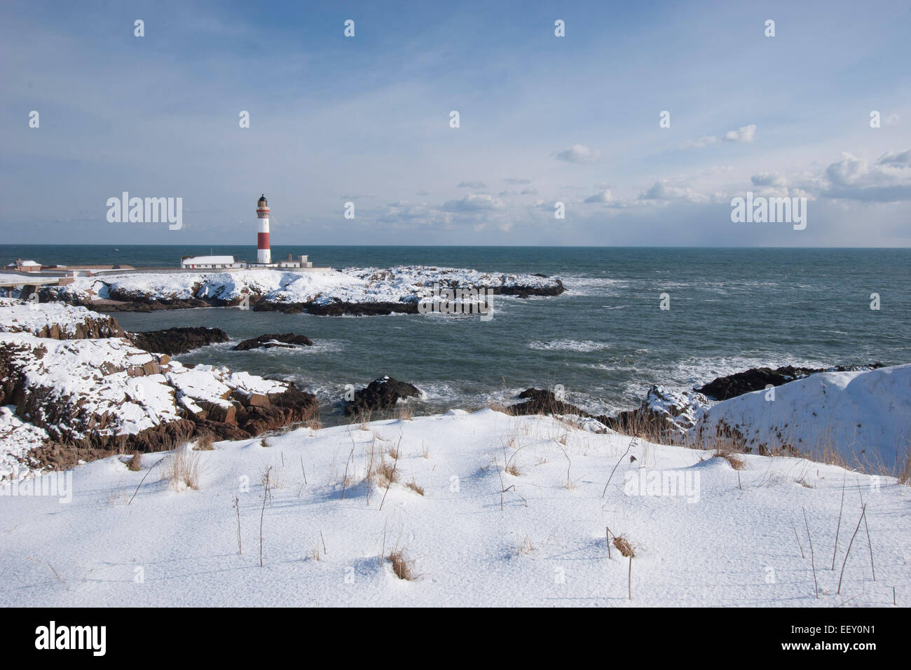 Lighthouse in the snow Stock Photo - Alamy