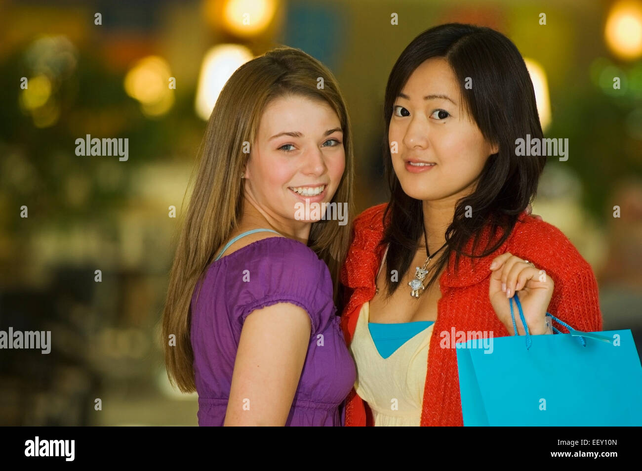 Two friends at a mall Stock Photo - Alamy