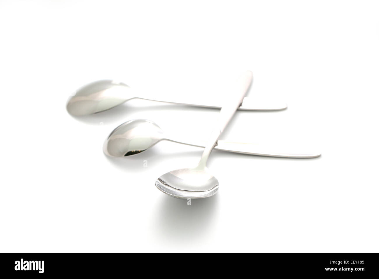 three spoons isolated on white background Stock Photo - Alamy