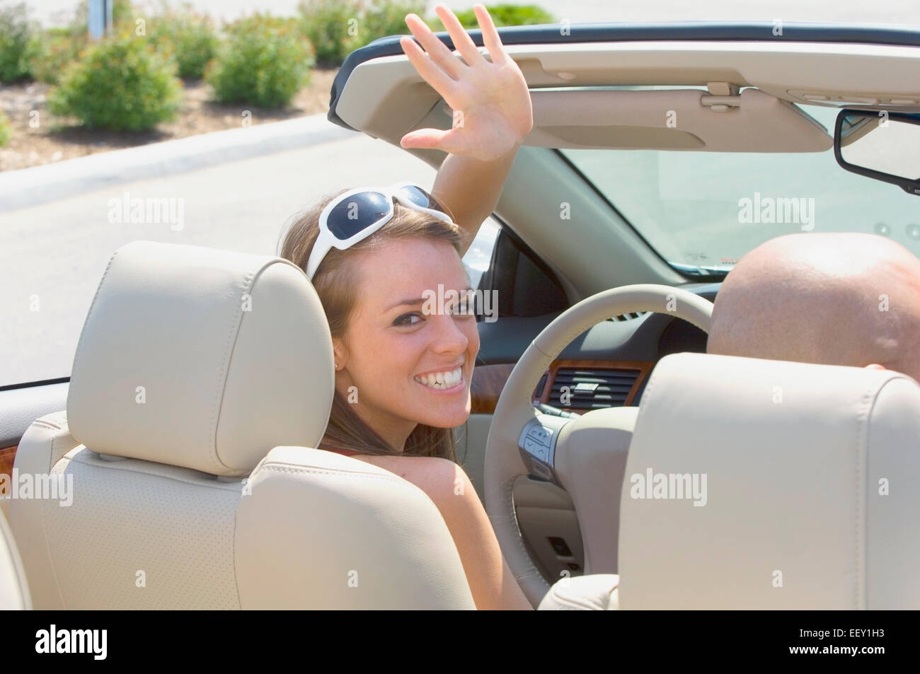 Couple driving in convertible Stock Photo - Alamy