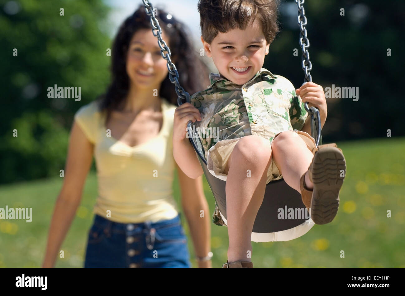 Child pushed on swing hi-res stock photography and images - Alamy