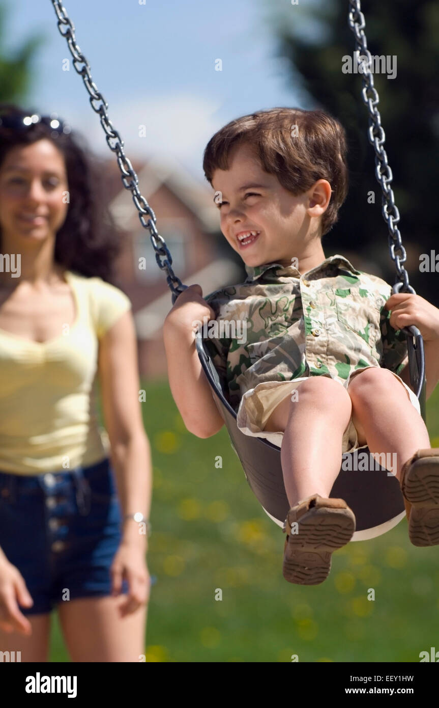 Child pushed on swing hi-res stock photography and images - Alamy