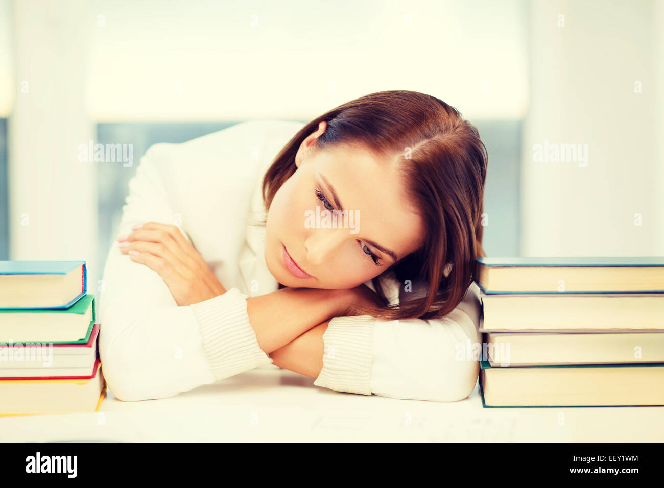 tired student with books and notes Stock Photo - Alamy