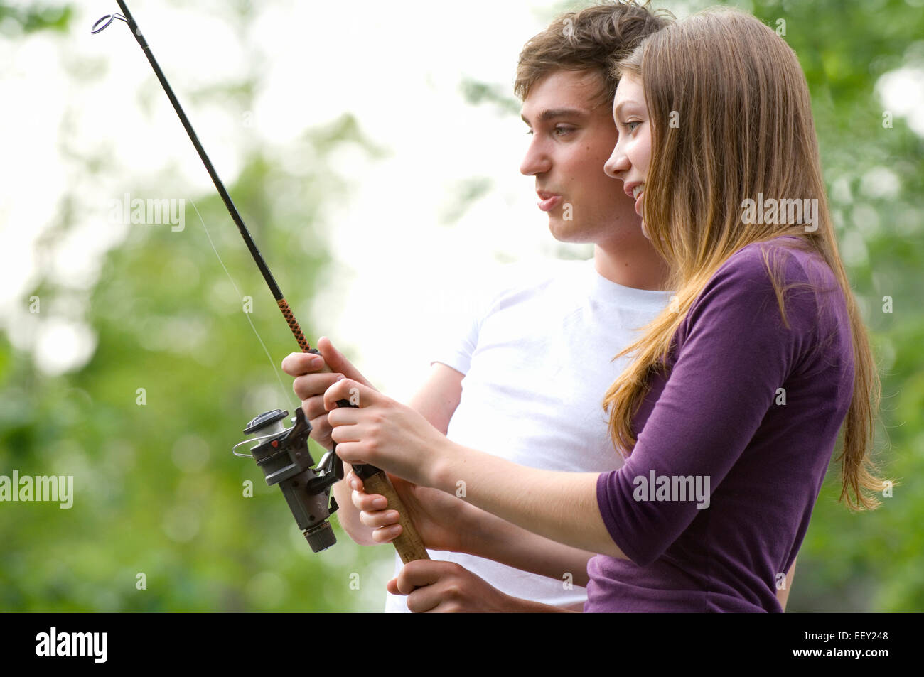 Two teenager adult fishing hi-res stock photography and images - Alamy