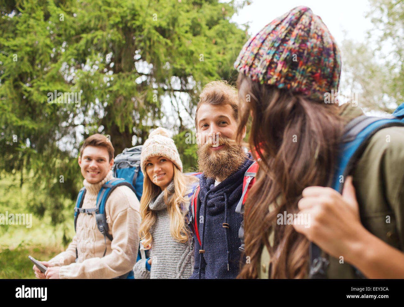 group of friends with backpacks and tablet pc Stock Photo - Alamy