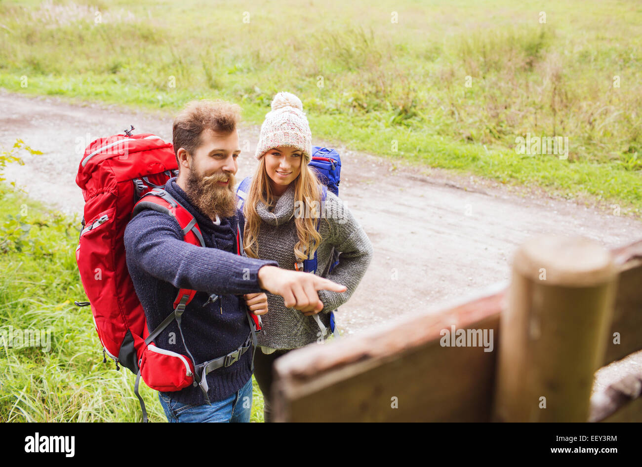 Teamwork travelers man woman backpacks hi-res stock photography and ...