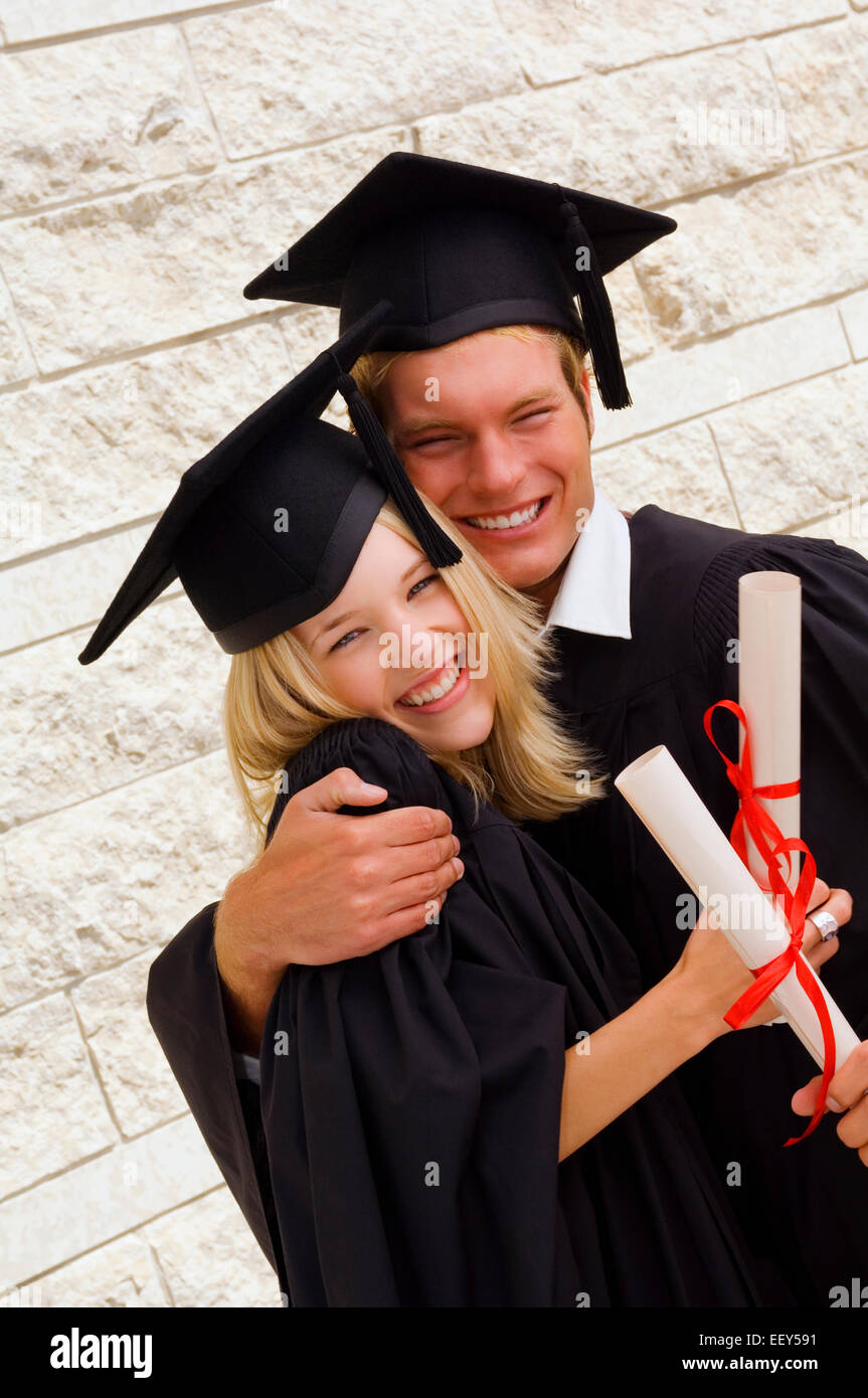 Young man and woman at graduation ceremony Stock Photo - Alamy