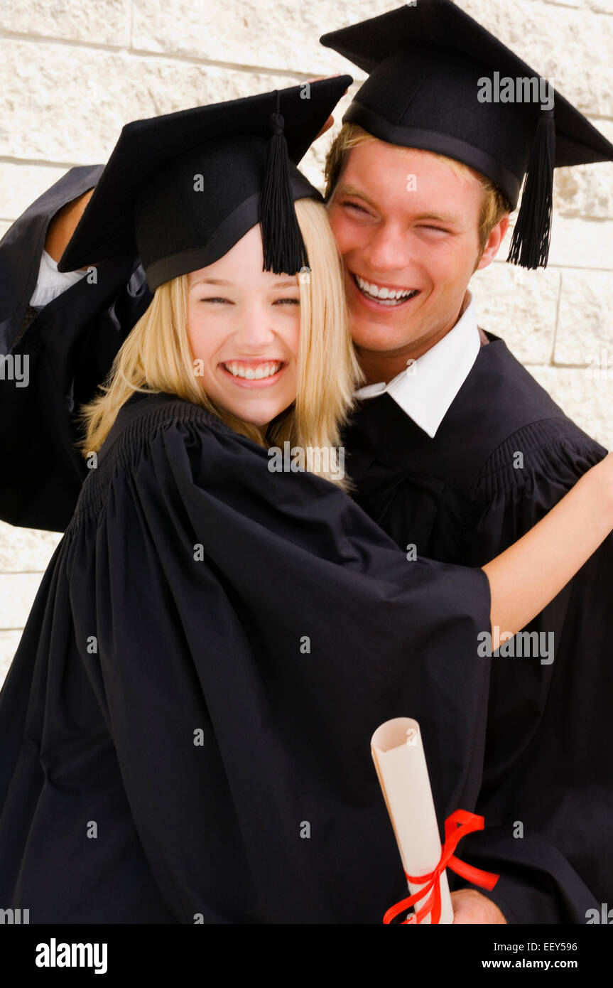 Young man and woman at graduation ceremony Stock Photo - Alamy