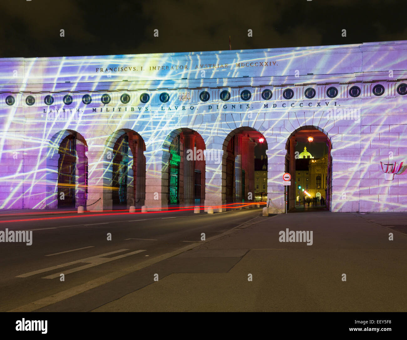 Light show on the ancient outer castle gate and arches in Heldenplatz ...