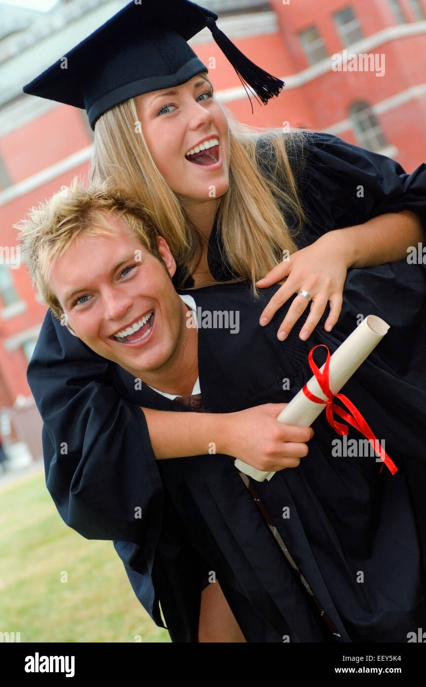 Young man and woman at graduation ceremony Stock Photo - Alamy