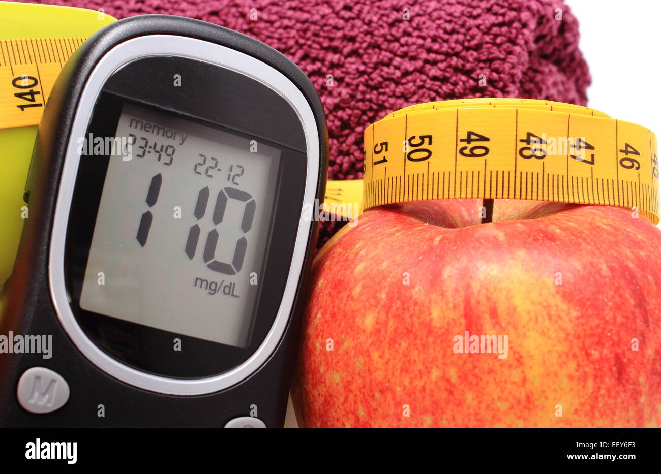 Glucometer, fresh apple and tape measure, concept for diabetes ...