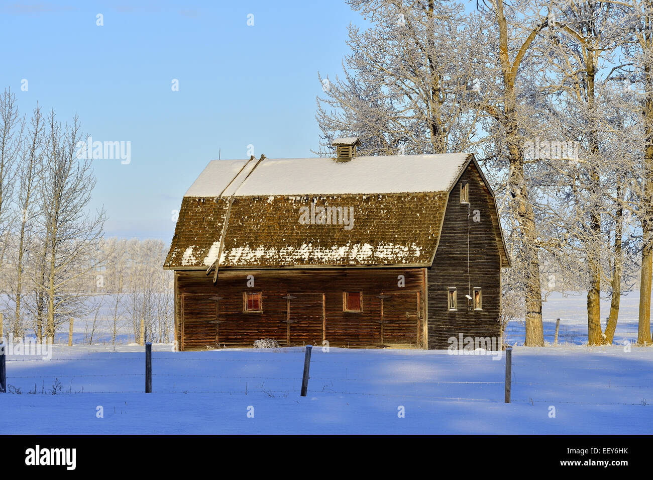 A landscape of a barn on an abandoned piece of farm land in rural ...