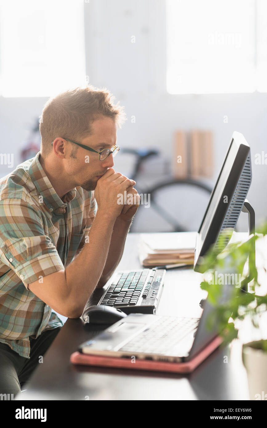 Man using computer in office Stock Photo - Alamy