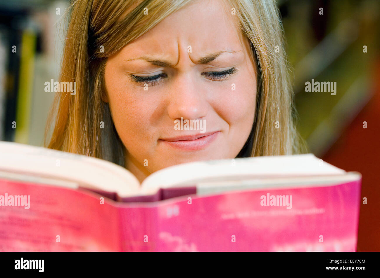 Young woman reading a book Stock Photo - Alamy