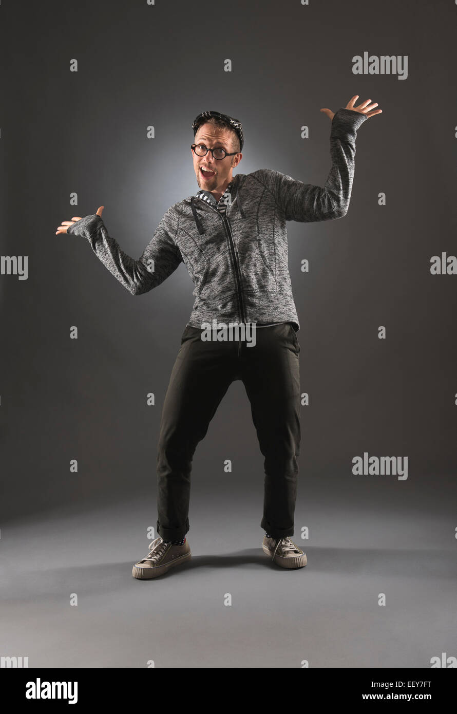 Studio shot of man in gray clothing Stock Photo - Alamy