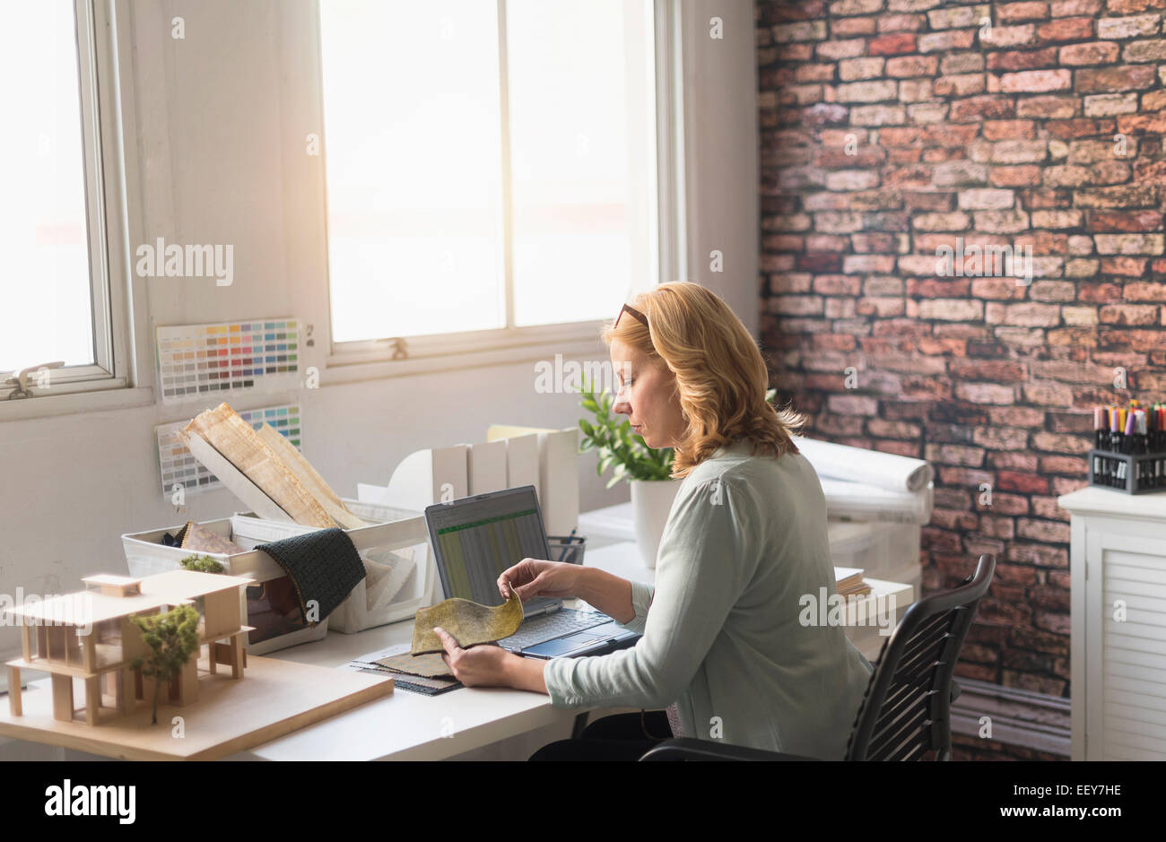 Female interior designer at work Stock Photo - Alamy