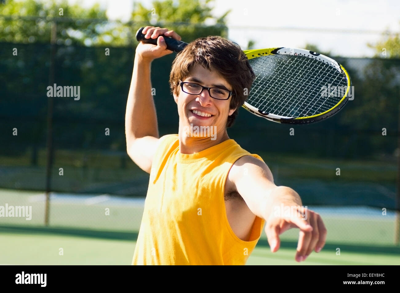 Tennis player alone on a court Stock Photo - Alamy