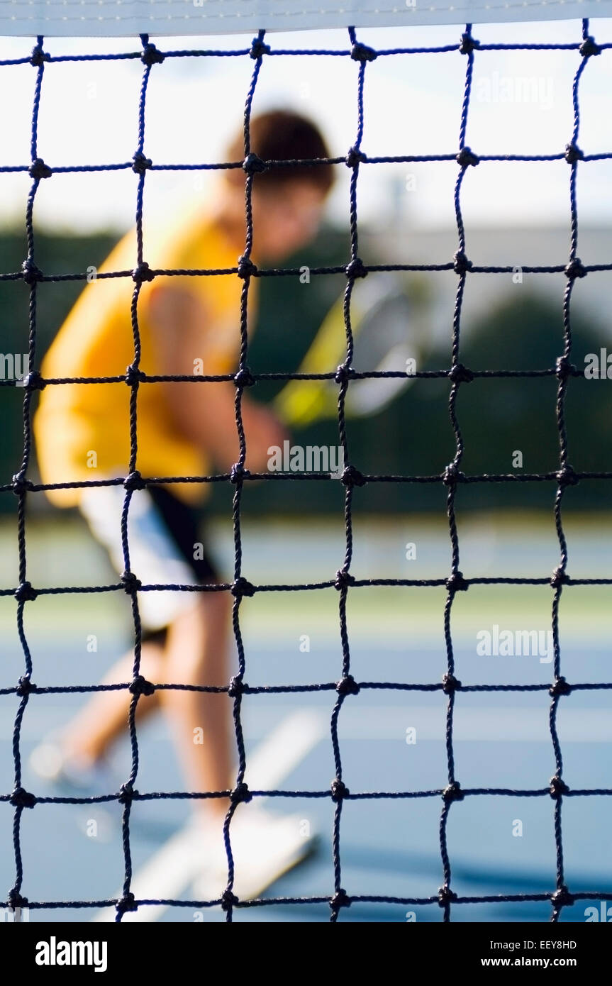 Tennis player alone on a court Stock Photo - Alamy