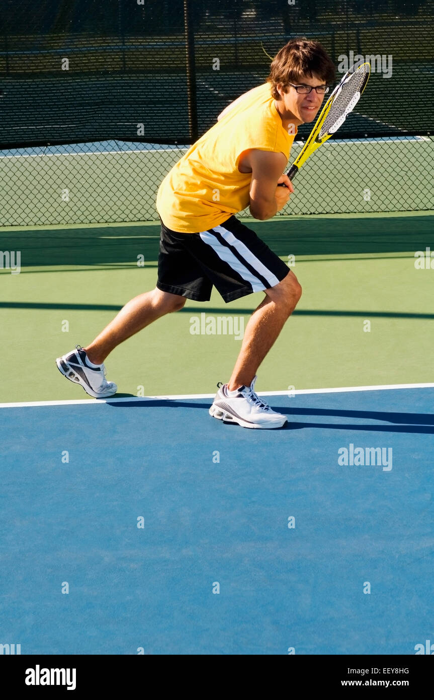 Tennis player alone on a court Stock Photo - Alamy