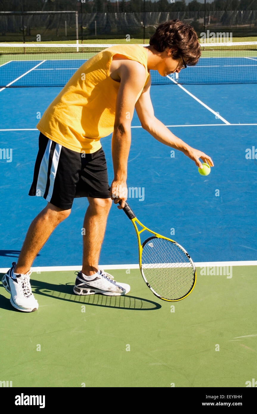 Tennis player alone on a court Stock Photo - Alamy