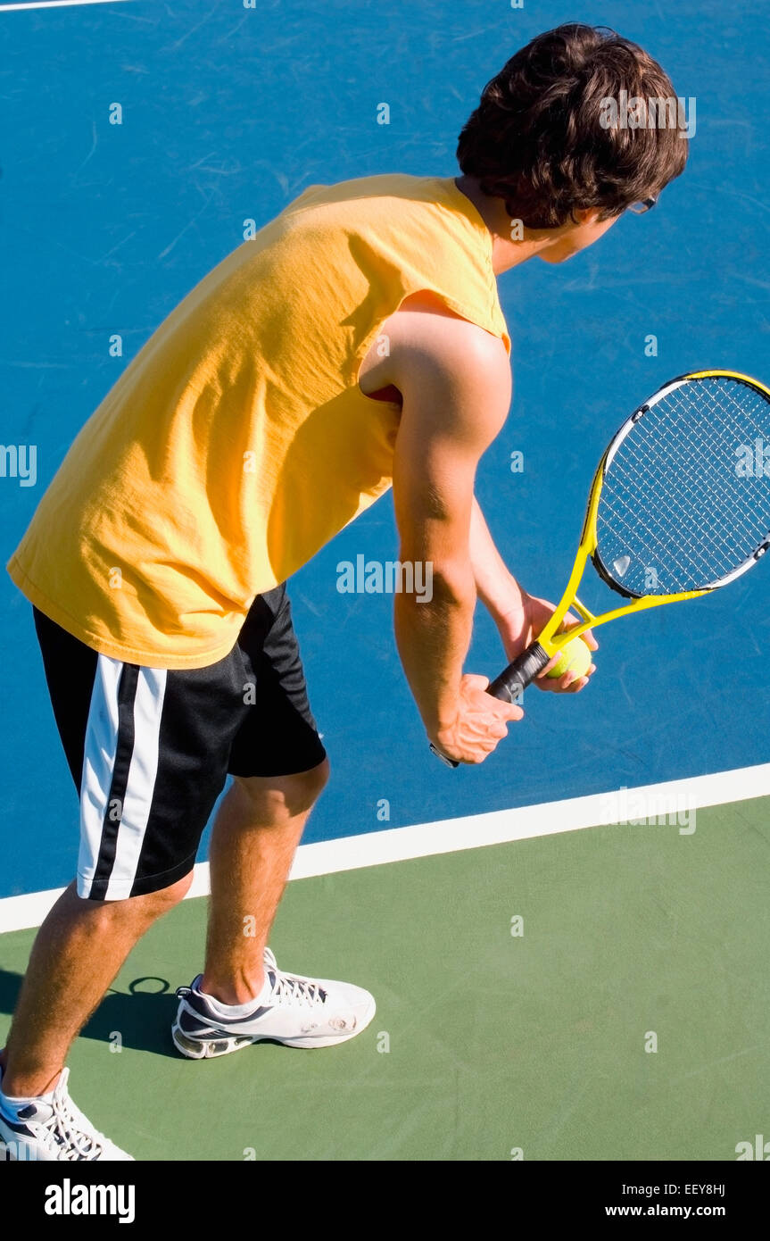 Tennis player alone on a court Stock Photo - Alamy