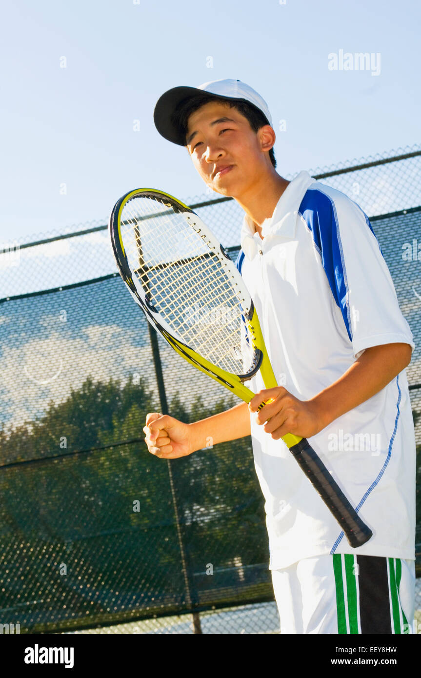 Tennis player alone on a court Stock Photo - Alamy