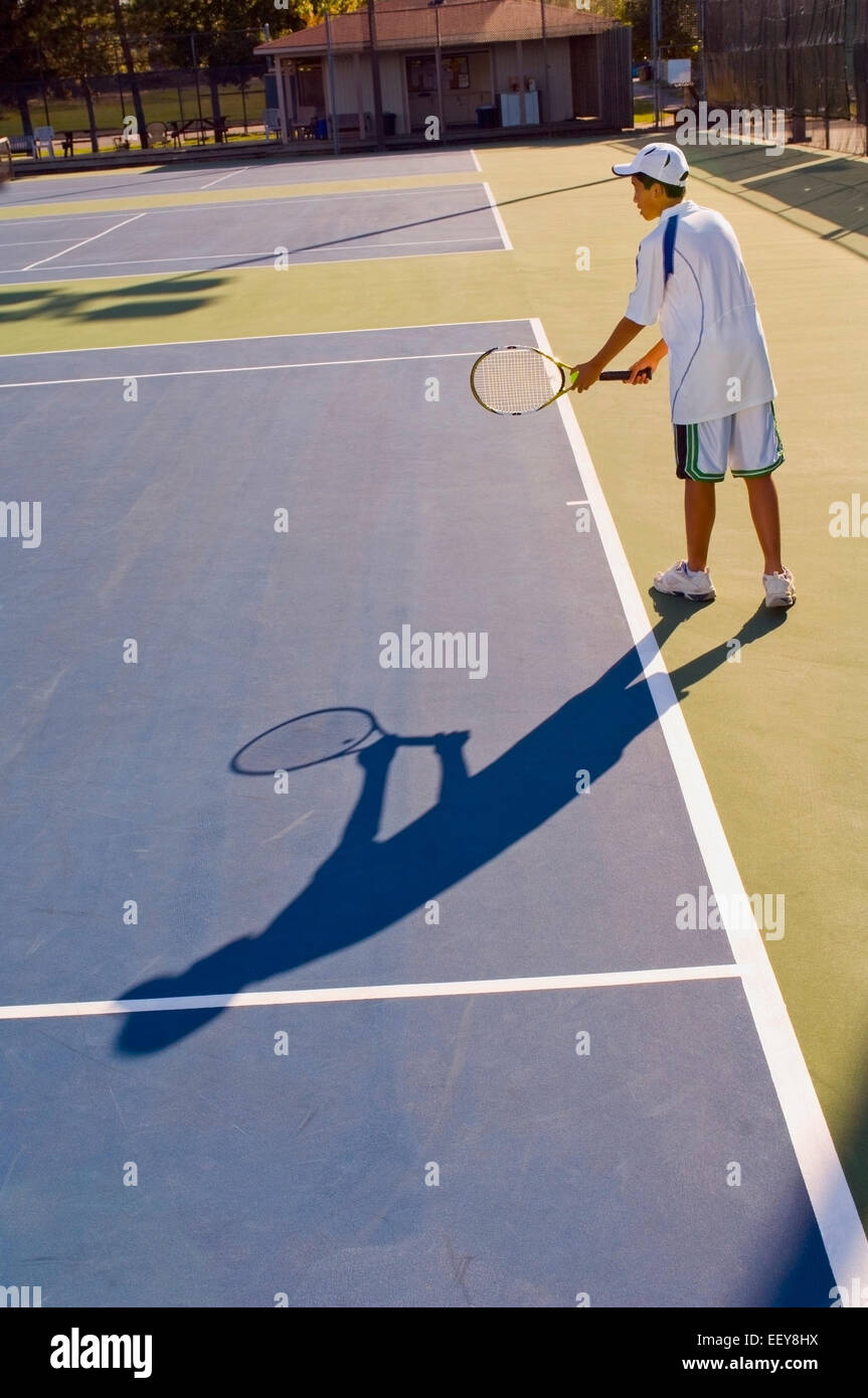 Tennis player alone on a court Stock Photo - Alamy
