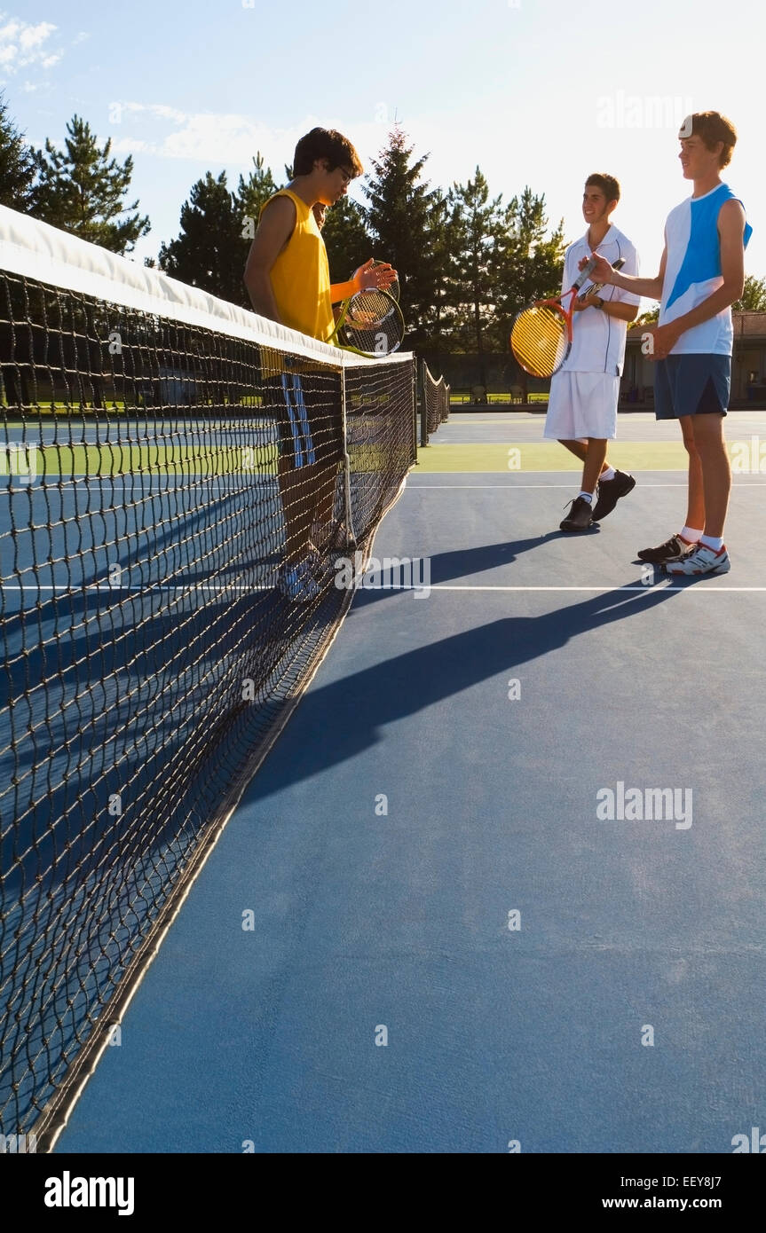 Group of tennis players on a court Stock Photo - Alamy