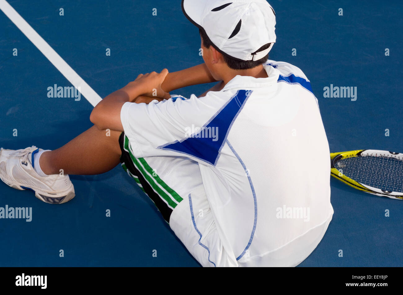 Tennis player alone on a court Stock Photo - Alamy