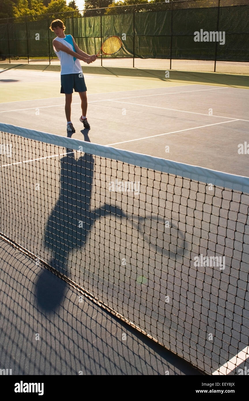 Tennis player alone on a court Stock Photo - Alamy