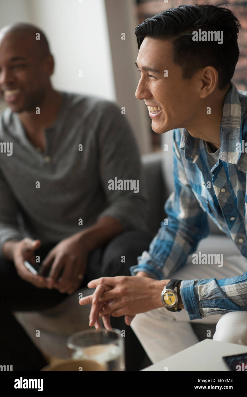 Man laughing during meeting with friends Stock Photo - Alamy