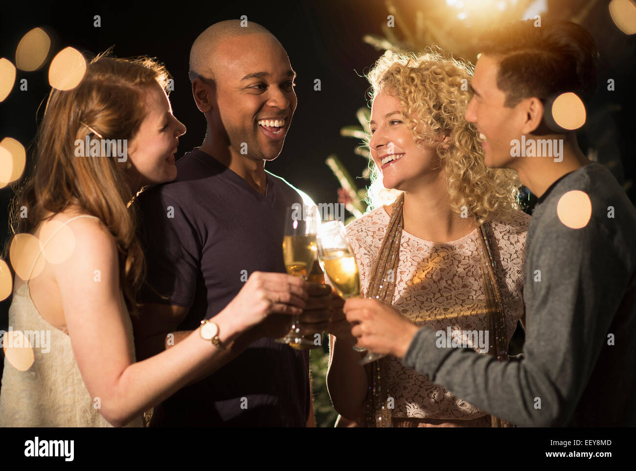 Multi ethnic friends celebrating new hi-res stock photography and ...