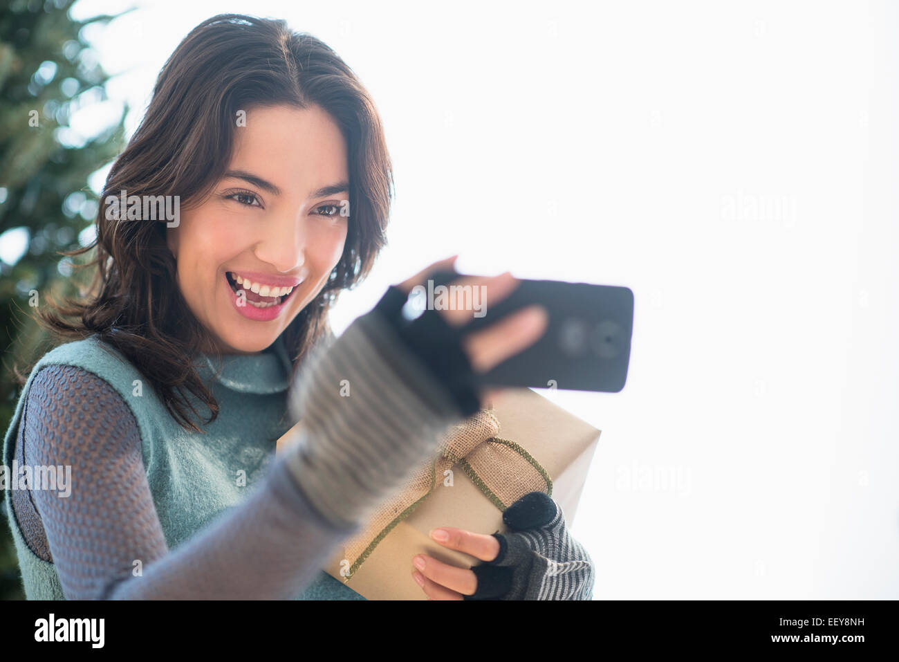 Young woman taking selfie with mobile phone Stock Photo - Alamy