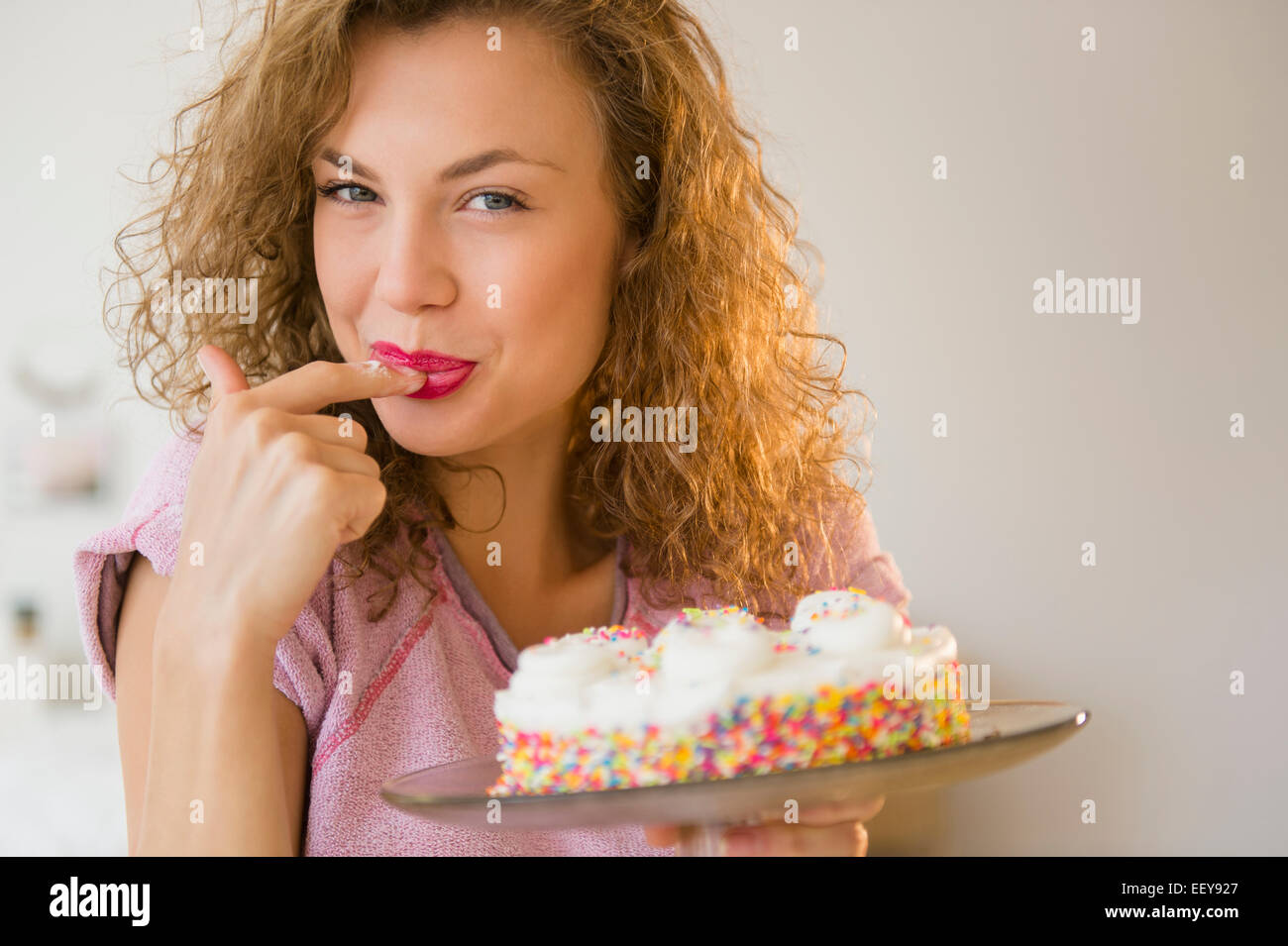 Woman Eating Birthday Cake